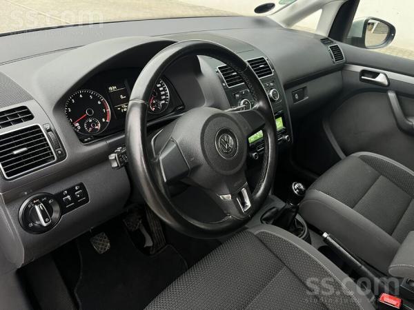 Grey Volkswagen Touran 2013 in Riga, with an engine capacity of 1.40 L and mileage of 219 thousand km for 5450 €, photo 7 on AUTOMOTO.COM.LV