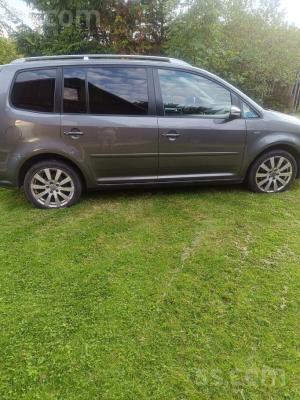 Grey Volkswagen Touran 2013 in Riga, with an engine capacity of 1.60 L and mileage of 251 thousand km for 5100 €, photo  on AUTOMOTO.COM.LV