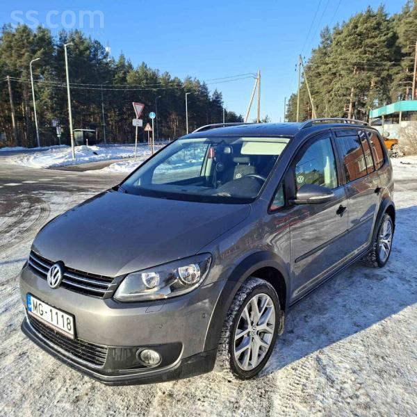 Grey Volkswagen Touran 2014 in Riga, with an engine capacity of 2.00 L and mileage of 358 thousand km for 6900 €, photo 1 on AUTOMOTO.COM.LV