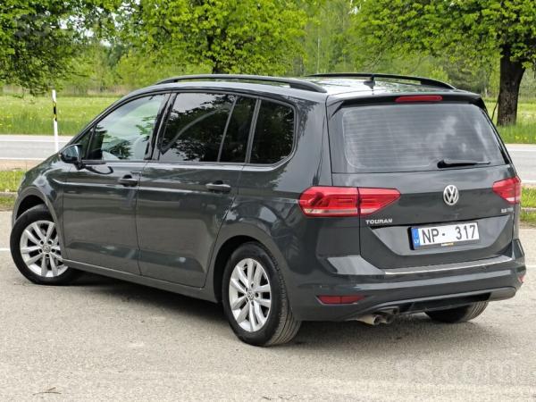 Grey Volkswagen Touran 2016 in Ogre, with an engine capacity of 2.00 L and mileage of 328 thousand km for 9770 €, photo 6 on AUTOMOTO.COM.LV