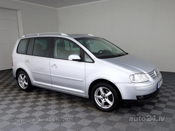 Grey Volkswagen Touran 2006 in Tallinn, with an engine capacity of 1.60 L and mileage of 239 thousand km for 899 €, photo 1 on AUTOMOTO.COM.LV