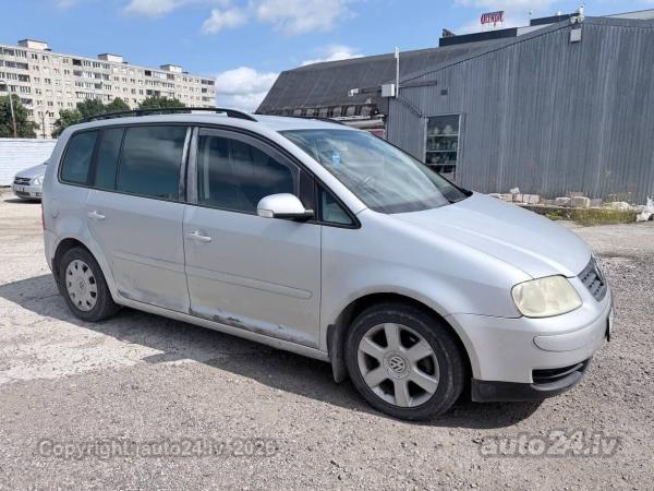 Grey Volkswagen Touran 2006 in Tallinn, with an engine capacity of 1.90 L and mileage of 259 thousand km for 599 €, photo 1 on AUTOMOTO.COM.LV