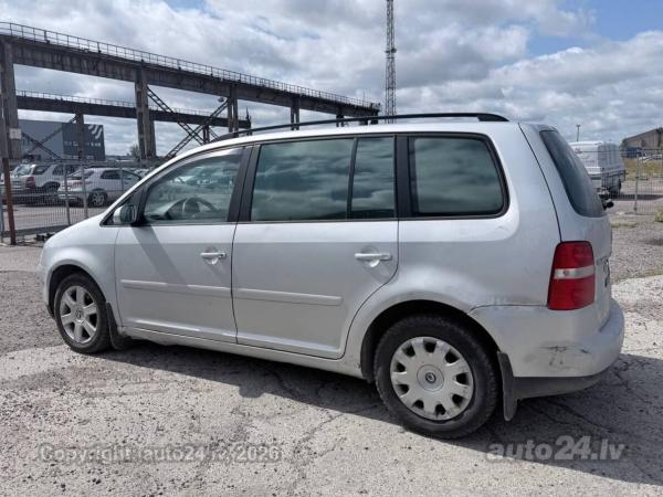 Grey Volkswagen Touran 2006 in Tallinn, with an engine capacity of 1.90 L and mileage of 259 thousand km for 599 €, photo 4 on AUTOMOTO.COM.LV