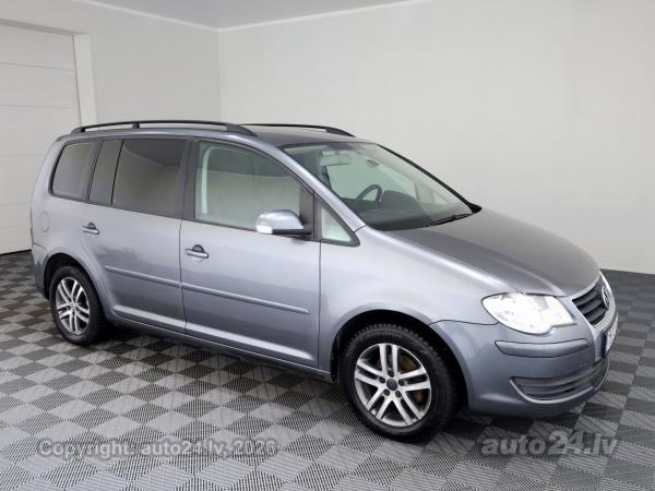 Grey Volkswagen Touran 2007 in Tallinn, with an engine capacity of 1.90 L and mileage of 299 thousand km for 1999 €, photo 1 on AUTOMOTO.COM.LV