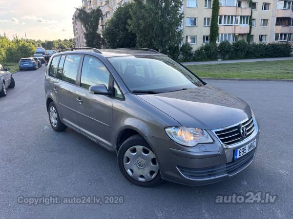 Grey Volkswagen Touran 2007 in Tallinn, with an engine capacity of 1.90 L and mileage of 259 thousand km for 1399 €, photo 1 on AUTOMOTO.COM.LV