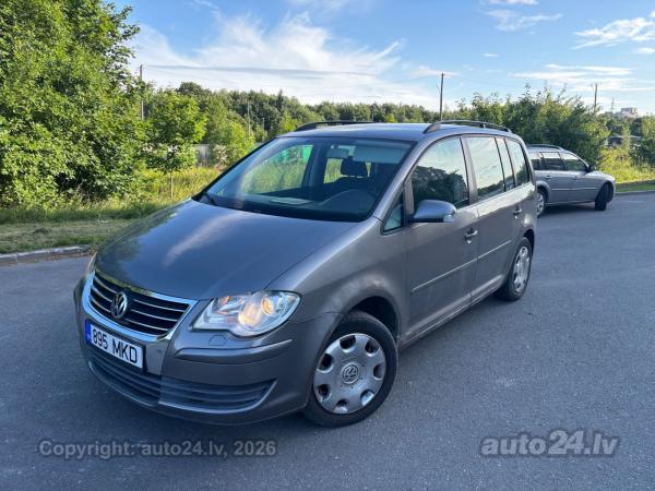 Grey Volkswagen Touran 2007 in Tallinn, with an engine capacity of 1.90 L and mileage of 259 thousand km for 1399 €, photo 3 on AUTOMOTO.COM.LV