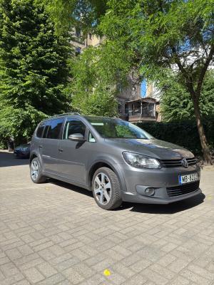 Grey Volkswagen Touran 2012 in Riga, with an engine capacity of 2.00 L and mileage of 230 thousand km for 9700 €, photo 2 on AUTOMOTO.COM.LV