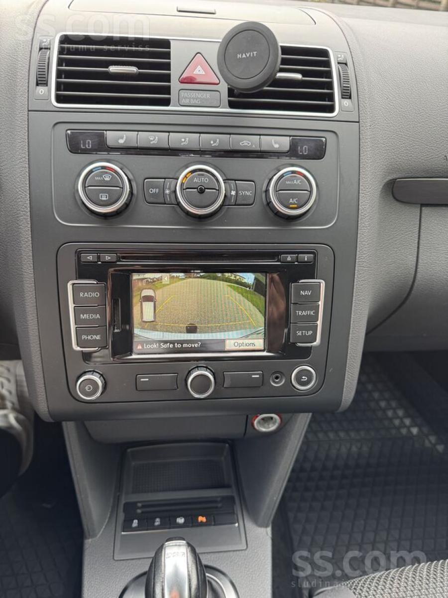 Grey Volkswagen Touran 2012 in Riga, with an engine capacity of 1.60 L and mileage of 218 thousand km for 6100 €, photo 17 on AUTOMOTO.COM.LV