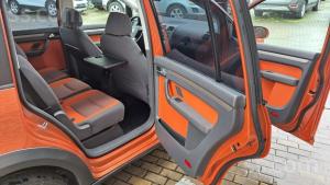 Orange Volkswagen Touran 2007 in Talsi, with an engine capacity of 2.00 L and mileage of 0 thousand km for 5440 €, photo 15 on AUTOMOTO.COM.LV
