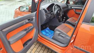 Orange Volkswagen Touran 2007 in Talsi, with an engine capacity of 2.00 L and mileage of 0 thousand km for 5440 €, photo 47 on AUTOMOTO.COM.LV