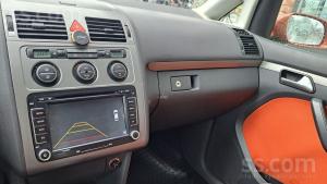 Orange Volkswagen Touran 2007 in Talsi, with an engine capacity of 2.00 L and mileage of 0 thousand km for 5440 €, photo 27 on AUTOMOTO.COM.LV