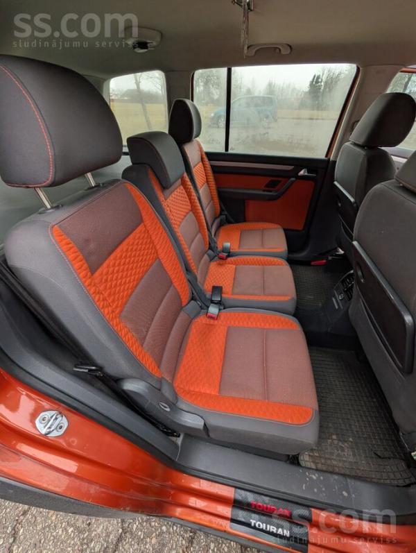 Orange Volkswagen Touran 2007 in Cesis, with an engine capacity of 1.90 L and mileage of 310 thousand km for 1850 €, photo 8 on AUTOMOTO.COM.LV