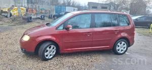 Sarkans Volkswagen Touran 2005 Rīga, ar dzinēja tilpumu 2.00 L un nobraukumu 230 tūkst. km par 3500 €, foto 5 vietnē AUTOMOTO.COM.LV