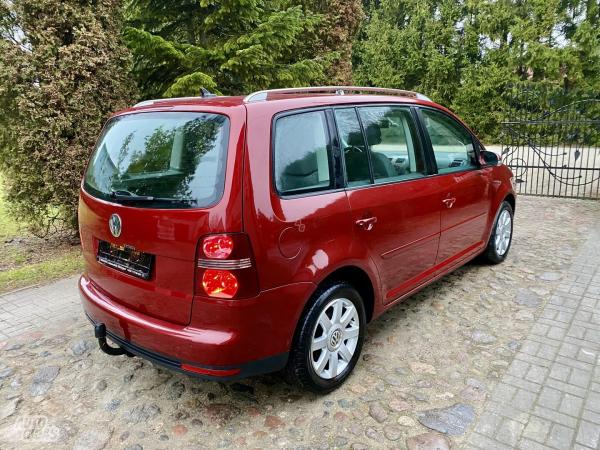 Red Volkswagen Touran 2006 in Siauliai, with an engine capacity of 1.40 L and mileage of 178 thousand km for 2999 €, photo 4 on AUTOMOTO.COM.LV