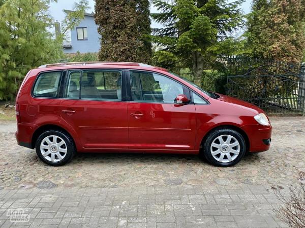 Red Volkswagen Touran 2006 in Siauliai, with an engine capacity of 1.40 L and mileage of 178 thousand km for 2999 €, photo 6 on AUTOMOTO.COM.LV