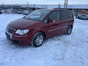 Red Volkswagen Touran 2007 in Kaunas, with an engine capacity of 1.39 L and mileage of 195 thousand km for 3550 €, photo  on AUTOMOTO.COM.LV