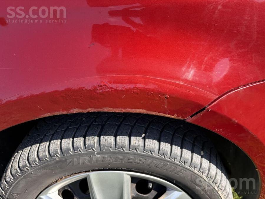 Sarkans Volkswagen Touran 2007 Rīga, ar dzinēja tilpumu 1.90 L un nobraukumu 28 tūkst. km par 2500 €, foto 10 vietnē AUTOMOTO.COM.LV
