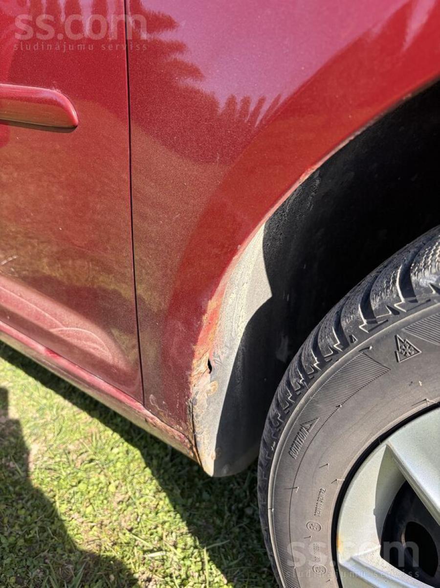 Sarkans Volkswagen Touran 2007 Rīga, ar dzinēja tilpumu 1.90 L un nobraukumu 28 tūkst. km par 2500 €, foto 11 vietnē AUTOMOTO.COM.LV