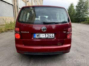 Red Volkswagen Touran 2007 in Riga, with an engine capacity of 1.90 L and mileage of 0 thousand km for 900 €, photo 7 on AUTOMOTO.COM.LV