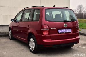 Red Volkswagen Touran 2009 in Kretinga, with an engine capacity of 1.40 L and mileage of 142 thousand km for 4999 €, photo 6 on AUTOMOTO.COM.LV