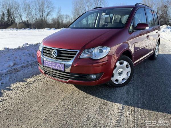 Sarkans Volkswagen Touran 2009 Kretinga, ar dzinēja tilpumu 1.40 L un nobraukumu 142 tūkst. km par 4999 €, foto 2 vietnē AUTOMOTO.COM.LV