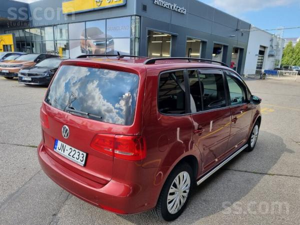 Red Volkswagen Touran 2010 in Riga, with an engine capacity of 2.00 L and mileage of 282 thousand km for 5400 €, photo 2 on AUTOMOTO.COM.LV