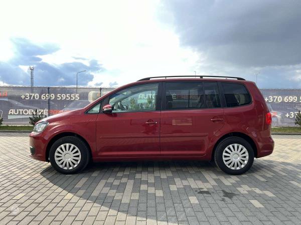 Red Volkswagen Touran 2011 in Siauliai, with an engine capacity of 1.39 L and mileage of 209 thousand km for 5200 €, photo 4 on AUTOMOTO.COM.LV
