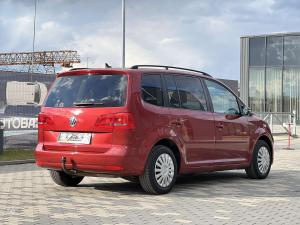 Red Volkswagen Touran 2011 in Siauliai, with an engine capacity of 1.39 L and mileage of 209 thousand km for 5200 €, photo 8 on AUTOMOTO.COM.LV