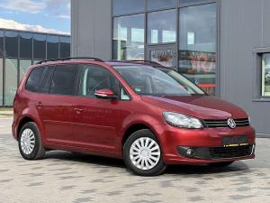 Red Volkswagen Touran 2011 in Siauliai, with an engine capacity of 1.39 L and mileage of 209 thousand km for 5200 €, photo 11 on AUTOMOTO.COM.LV