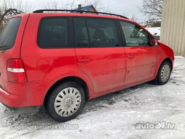 Red Volkswagen Touran 2005 in Tartu, with an engine capacity of 1.90 L and mileage of 0 thousand km for 1499 €, photo 4 on AUTOMOTO.COM.LV