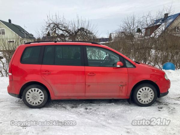 Red Volkswagen Touran 2005 in Tartu, with an engine capacity of 1.90 L and mileage of 0 thousand km for 1499 €, photo 5 on AUTOMOTO.COM.LV