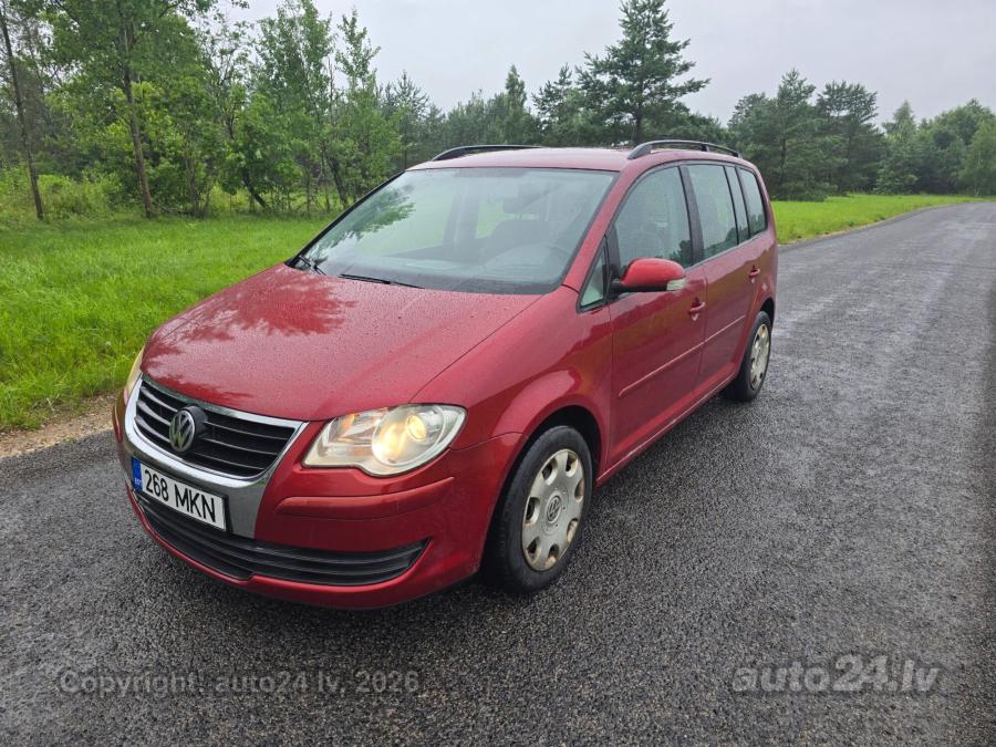 Red Volkswagen Touran 2007 in Tartu, with an engine capacity of 1.60 L and mileage of 189 thousand km for 2400 €, photo 1 on AUTOMOTO.COM.LV