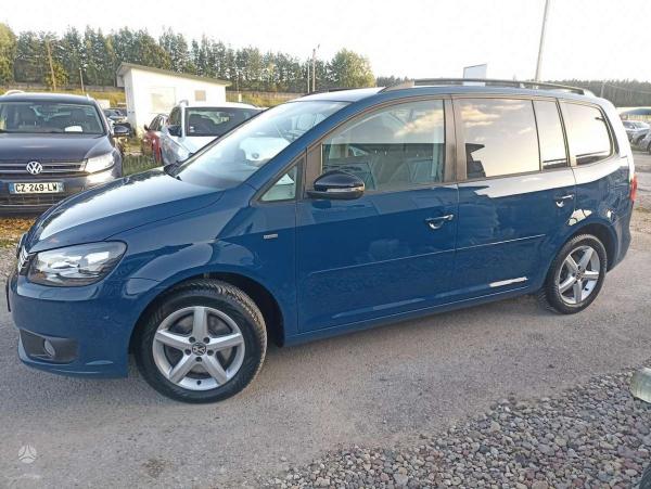 Violet Volkswagen Touran 2013 in Vilnius, with an engine capacity of 1.39 L and mileage of 213 thousand km for 6450 €, photo 9 on AUTOMOTO.COM.LV