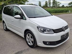 White Volkswagen Touran 2011 in Ukmerge, with an engine capacity of 1.20 L and mileage of 241 thousand km for 3950 €, photo 3 on AUTOMOTO.COM.LV