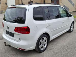 White Volkswagen Touran 2011 in Ukmerge, with an engine capacity of 1.20 L and mileage of 241 thousand km for 3950 €, photo 5 on AUTOMOTO.COM.LV