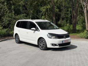 White Volkswagen Touran 2011 in Vilnius, with an engine capacity of 1.60 L and mileage of 214 thousand km for 3999 €, photo 8 on AUTOMOTO.COM.LV
