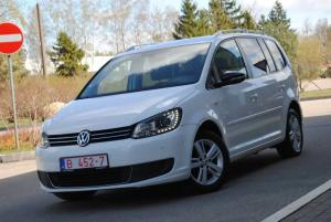 White Volkswagen Touran 2012 in Riga, with an engine capacity of 1.60 L and mileage of 238 thousand km for 7290 €, photo  on AUTOMOTO.COM.LV
