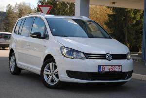 White Volkswagen Touran 2012 in Riga, with an engine capacity of 1.60 L and mileage of 238 thousand km for 7290 €, photo 5 on AUTOMOTO.COM.LV