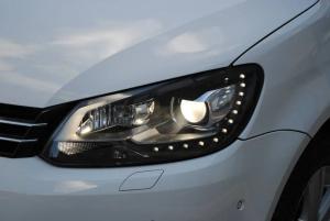 White Volkswagen Touran 2012 in Riga, with an engine capacity of 1.60 L and mileage of 238 thousand km for 7290 €, photo 23 on AUTOMOTO.COM.LV