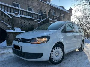 White Volkswagen Touran 2014 in Kaunas, with an engine capacity of 1.60 L and mileage of 298 thousand km for 4999 €, photo  on AUTOMOTO.COM.LV