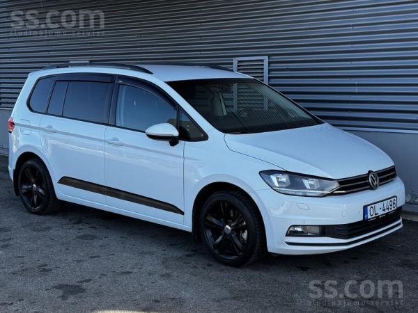 White Volkswagen Touran 2016 in Riga, with an engine capacity of 2.00 L and mileage of 226 thousand km for 8400 €, photo 7 on AUTOMOTO.COM.LV