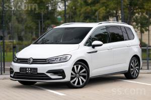 White Volkswagen Touran 2016 in Riga, with an engine capacity of 2.00 L and mileage of 202 thousand km for 13590 €, photo  on AUTOMOTO.COM.LV