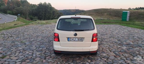 Yellow Volkswagen Touran 2007 in Druskininkai, with an engine capacity of 1.90 L and mileage of 342 thousand km for 800 €, photo 9 on AUTOMOTO.COM.LV