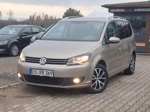 Yellow Volkswagen Touran 2012 in Riga, with an engine capacity of 1.60 L and mileage of 239 thousand km for 6777 €, photo 4 on AUTOMOTO.COM.LV