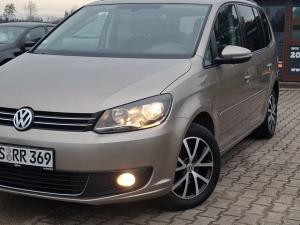Yellow Volkswagen Touran 2012 in Riga, with an engine capacity of 1.60 L and mileage of 239 thousand km for 6777 €, photo 6 on AUTOMOTO.COM.LV