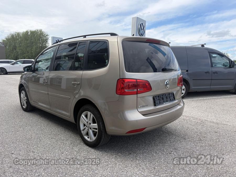 Yellow Volkswagen Touran 2012 in Viljandi, with an engine capacity of 1.20 L and mileage of 161 thousand km for 6990 €, photo 4 on AUTOMOTO.COM.LV