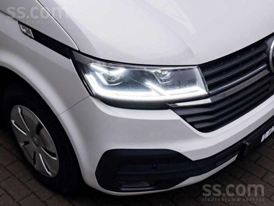 White Volkswagen Transporter 2023 in Riga, with an engine capacity of 2.00 L and mileage of 126 thousand km for 29900 €, photo 3 on AUTOMOTO.COM.LV