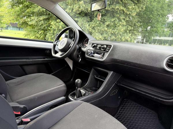 White Volkswagen Up 2015 in Kaunas, with an engine capacity of 1.00 L and mileage of 145 thousand km for 2690 €, photo 7 on AUTOMOTO.COM.LV