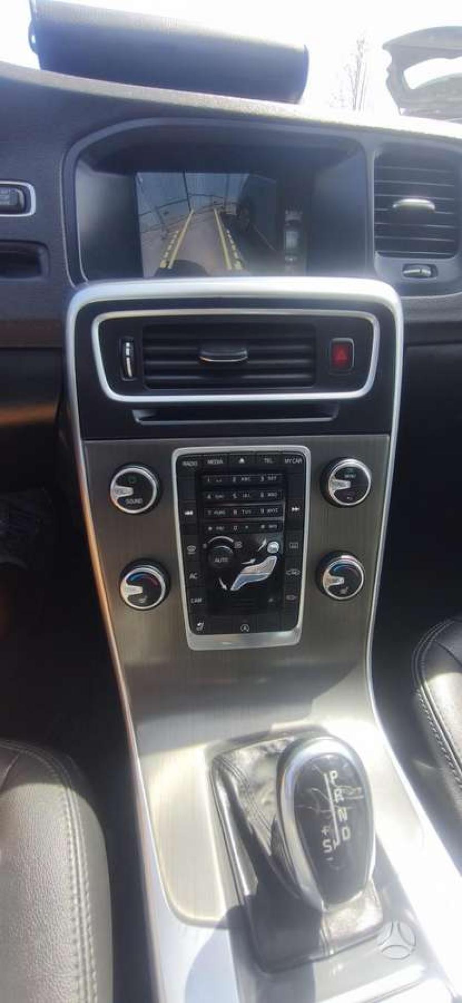 Brown Volvo S60 2015 in Klaipeda, with an engine capacity of 2.00 L and mileage of 200 thousand km for 5200 €, photo 26 on AUTOMOTO.COM.LV