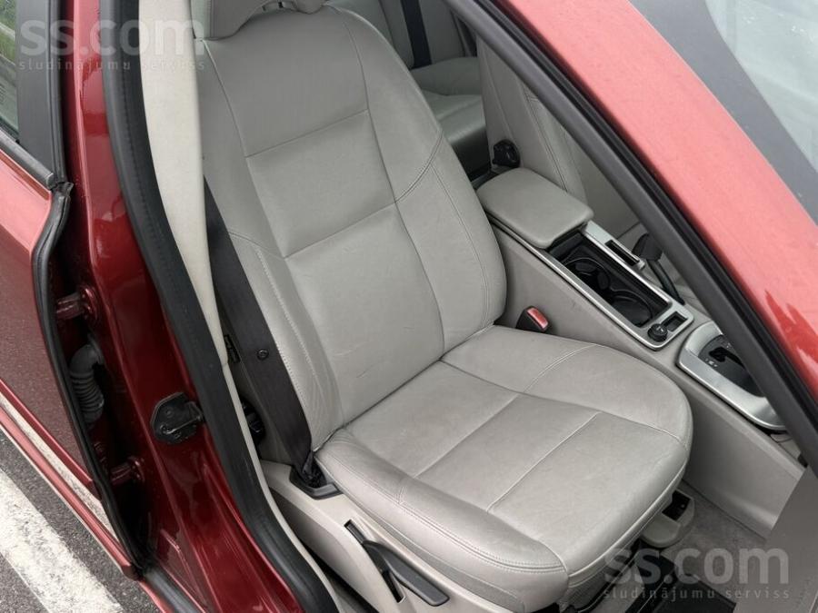Sarkans Volvo V50 2008 Liepāja, ar dzinēja tilpumu 2.40 L un nobraukumu 240 tūkst. km par 3950 €, foto 14 vietnē AUTOMOTO.COM.LV